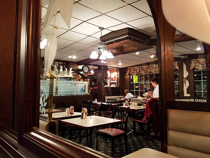 The dining room has that perfect lived-in feel. Wood paneling, patterned carpet, and the gentle hum of conversations that have been happening for decades.