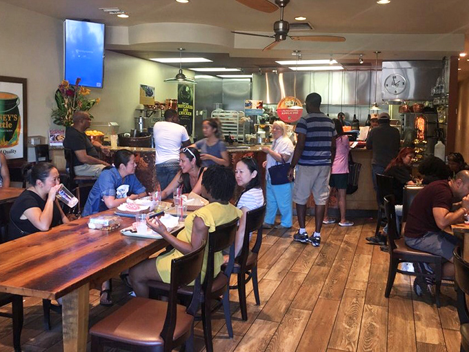 Where strangers become temporary family united by crispy chicken devotion. The bustling interior speaks volumes about what awaits at the end of that ordering line.