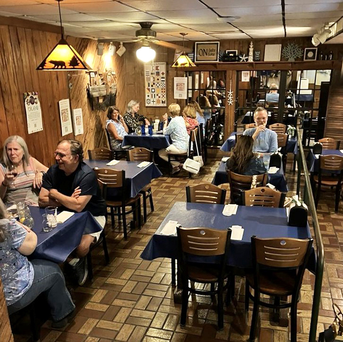The dining room hums with the universal language of seafood appreciation. Notice how nobody's talking? That's because their mouths are happily occupied.