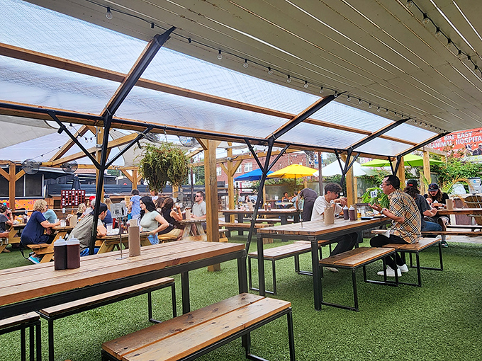 Under the covered patio, strangers become friends united by the universal language of "pass the sauce, please."