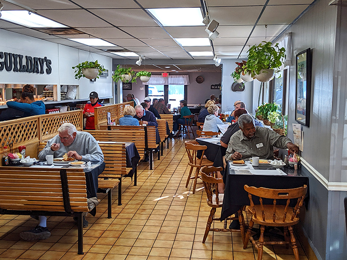 The true measure of a breakfast spot: loyal patrons who've made these wooden booths their morning headquarters for years.