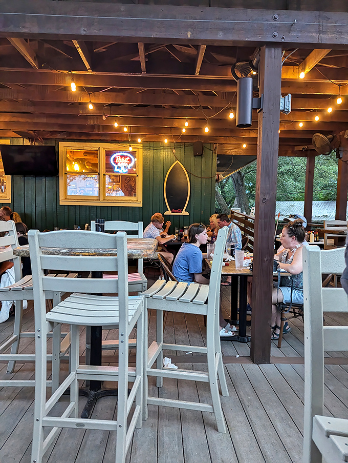 The outdoor dining area where strangers become friends over shared seafood enthusiasm. Notice nobody's looking at their phones?