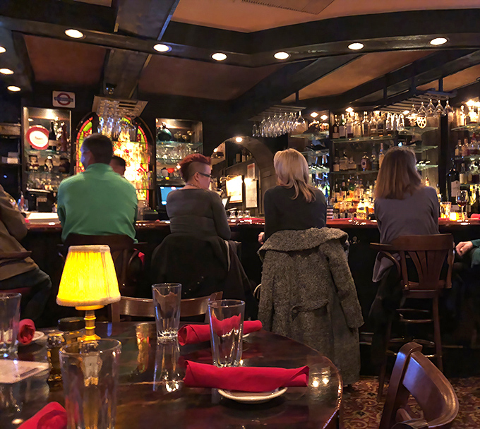 The bar scene at Sperry's: where Nashville's finest gather to debate everything from SEC football to whether the banana pudding beats Grandma's recipe.