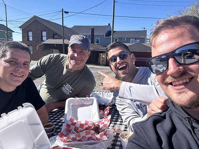 BBQ brings people together like nothing else—these smiles aren't just for the camera, they're the universal expression of "I can't believe how good this is."