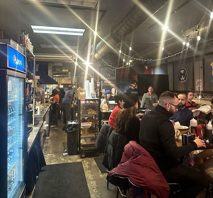 Real people enjoying real food in a setting that celebrates authentic American diner culture.