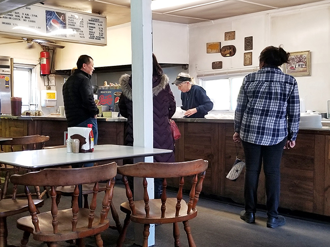 The line forms early at B's counter. Veterans know the drill: order quickly, find a seat, prepare for bliss.