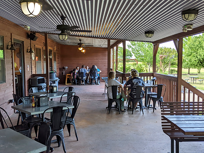 The covered porch offers al fresco dining with ceiling fans keeping the Texas heat at bay while patrons dive into plates of comfort food bliss.