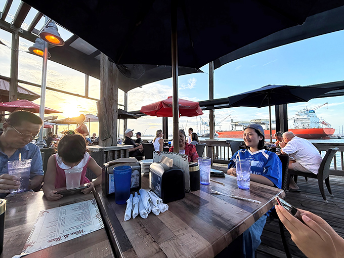 The outdoor deck at Rusty's offers front-row seats to Port Canaveral's maritime ballet, where ships become the backdrop for memorable meals.