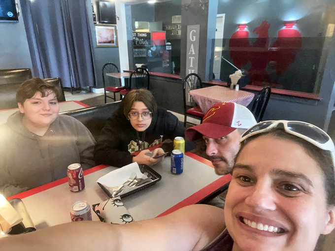 Happy diners experiencing that universal moment of food joy&mdash;when conversation pauses and all that matters is the next delicious bite.