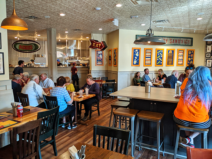 A bustling dining room where strangers are united by one common language: the universal "mmm" of sandwich satisfaction.