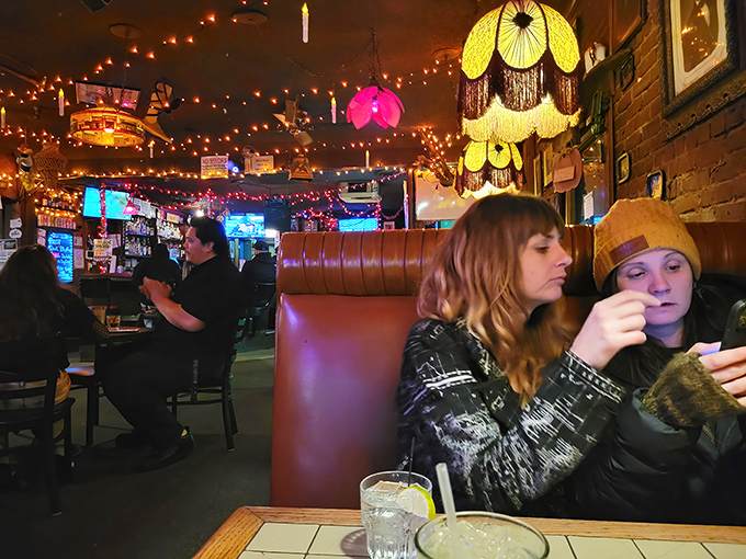 Under the glow of vintage lamps and string lights, diners find that perfect booth where conversations flow as easily as the coffee.