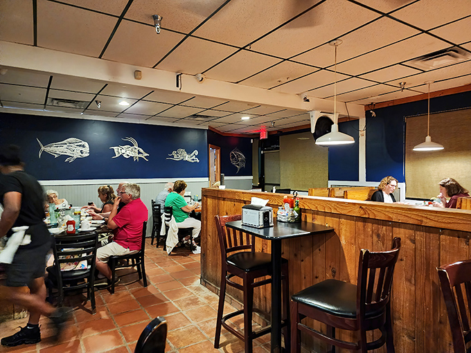 The blue wall with fish silhouettes reminds you what you're here for. Real people enjoying real food&mdash;what a concept!