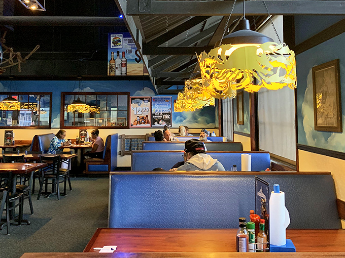The blue booth seating isn't just comfortable&mdash;it's the perfect vantage point for plotting your strategy through the menu's treasures.