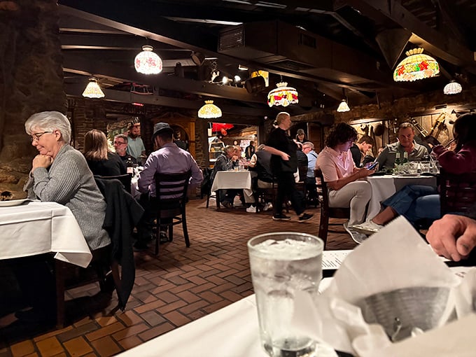 Stained glass lamps cast a warm glow over diners deep in conversation and deeper into their meals. Some restaurants serve food; this one creates memories.