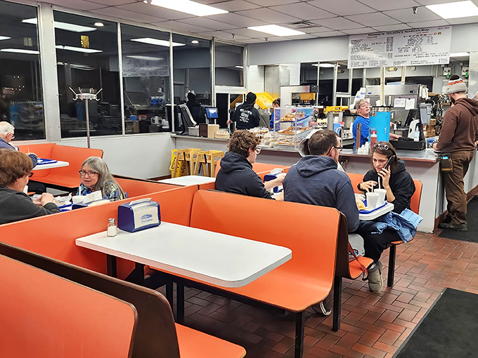 A typical lunch scene at Wilson's &ndash; where construction workers, office employees, and families all converge for the same simple pleasure: burger perfection without pretension.