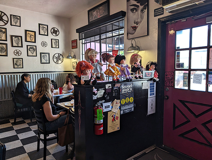 The host stand doubles as a quirky doll display. In most places that would be odd—here, it's just another charming reason to return.