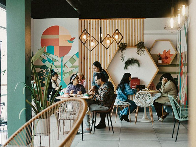 The universal language of good food bringing people together. Notice how nobody's on their phone? That's the power of perfect breakfast.