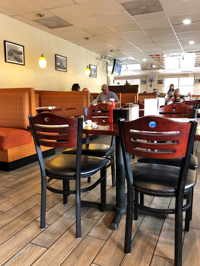 Every booth tells a story, and these orange-upholstered seats have heard thousands. Classic diner seating that invites you to settle in and stay awhile. 