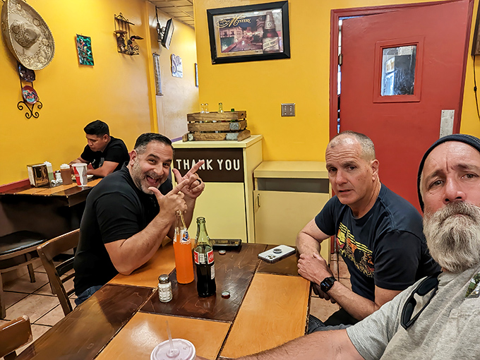 Happy diners caught in their natural habitat—the universal expression of people who've just discovered something too good not to share.