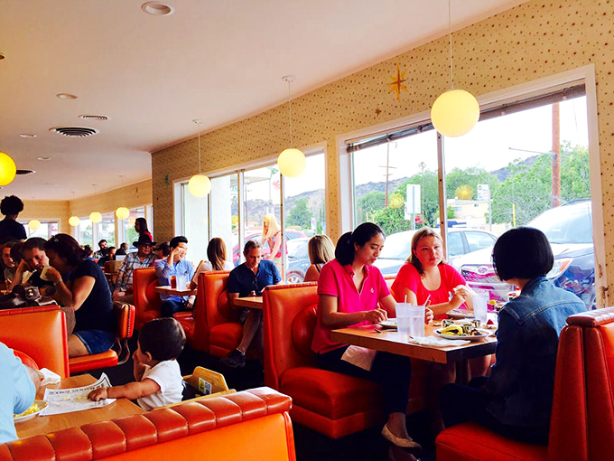 Where strangers become temporary breakfast companions. Notice how nobody's looking at their phones&mdash;the food demands full attention here.