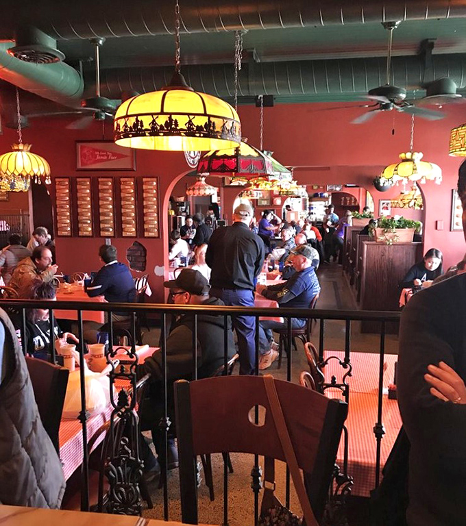 Where strangers become friends over shared hot dog enthusiasm. The bustling dining room speaks volumes about why locals keep coming back.