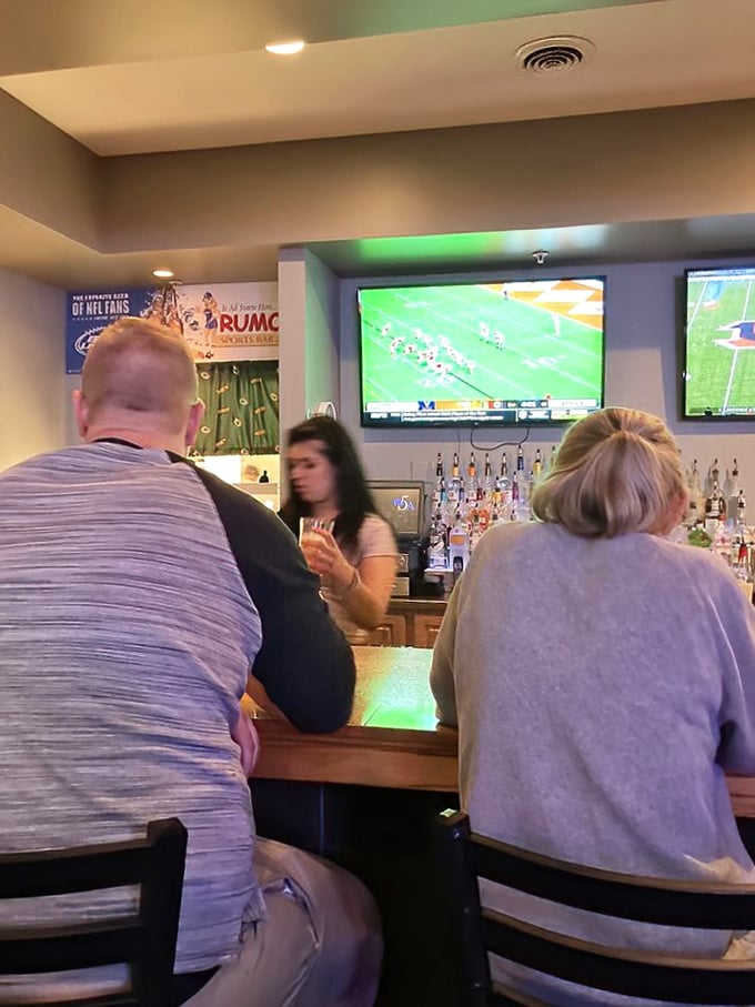 The bar area during game time&mdash;where strangers become friends and friends become family, united by sports and good drinks.