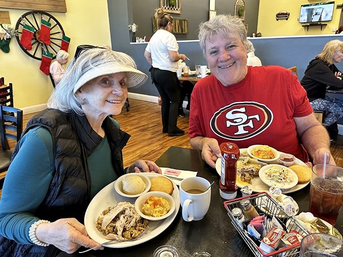 Happy diners sharing plates and stories &ndash; breakfast at Dena's isn't just a meal, it's a social occasion worth documenting.