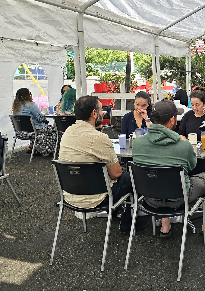The outdoor dining area: where breakfast conversations flow as freely as the coffee refills.