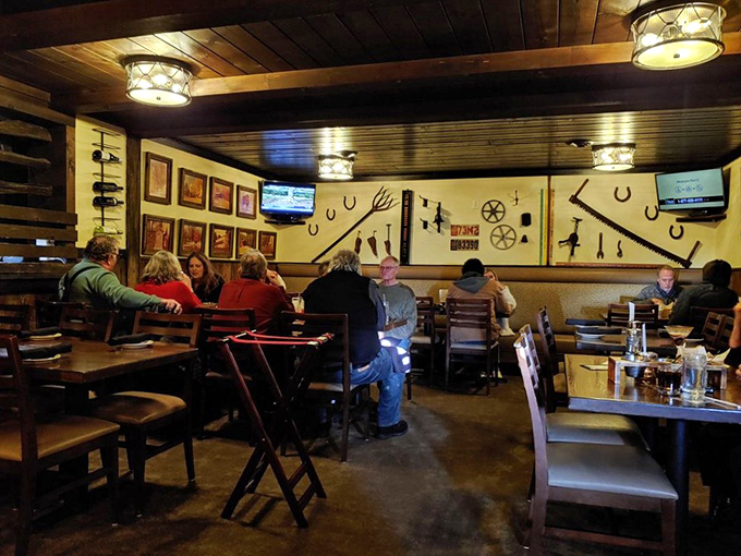Where locals gather beneath rustic lighting fixtures to enjoy good company and better food. Notice nobody's looking at their phones—the meal commands full attention.