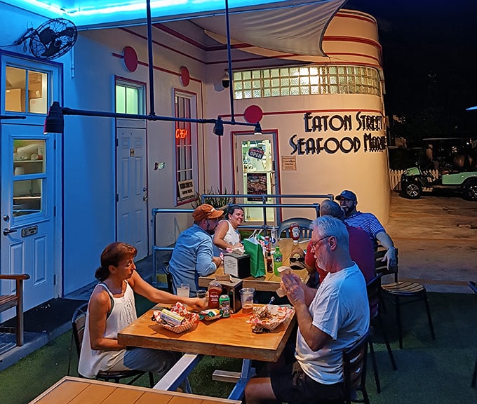 As evening falls, the restaurant glows with blue light and conversation. This is where memories are made between bites of exceptional seafood.