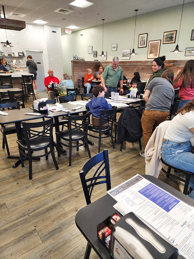 The dining room buzzes with conversation and laughter &ndash; the universal soundtrack of a community restaurant that feels like home. 