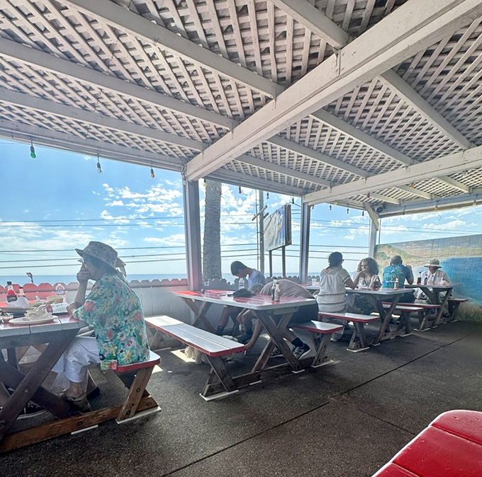 The covered patio where strangers become friends, united by the universal language of "Oh my god, you have to try this!"