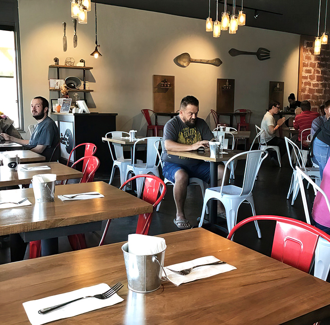 Where food enthusiasts gather to worship at the altar of good taste. The colorful chairs add just the right pop of personality.