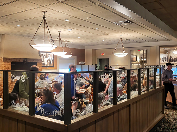 Glass dividers create intimate dining spaces while still letting you eyeball what everyone else ordered. Strategic table selection is key.