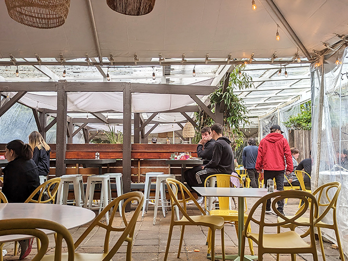 Even in winter, Sunflower's covered patio keeps the al fresco dream alive. Those yellow chairs aren't just furniture&mdash;they're mood enhancers.