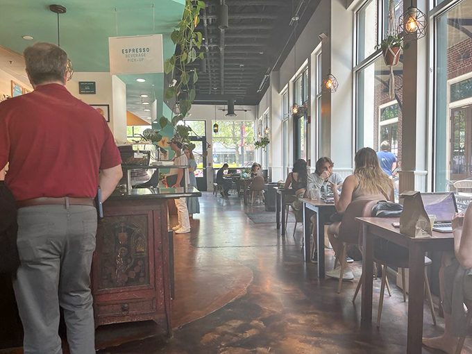 Where laptops meet lattes and deadlines get extended. The sunlight streaming through those windows makes productivity feel like a pleasure.