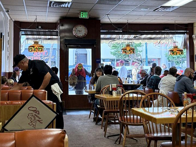 Morning democracy in action&mdash;diverse diners united by the universal language of good food, strong coffee, and the promise of a satisfying breakfast.