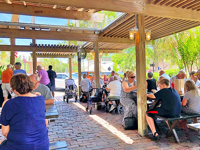 Where seafood brings people together—this bustling patio scene is the visual equivalent of the happy hum of satisfied diners.