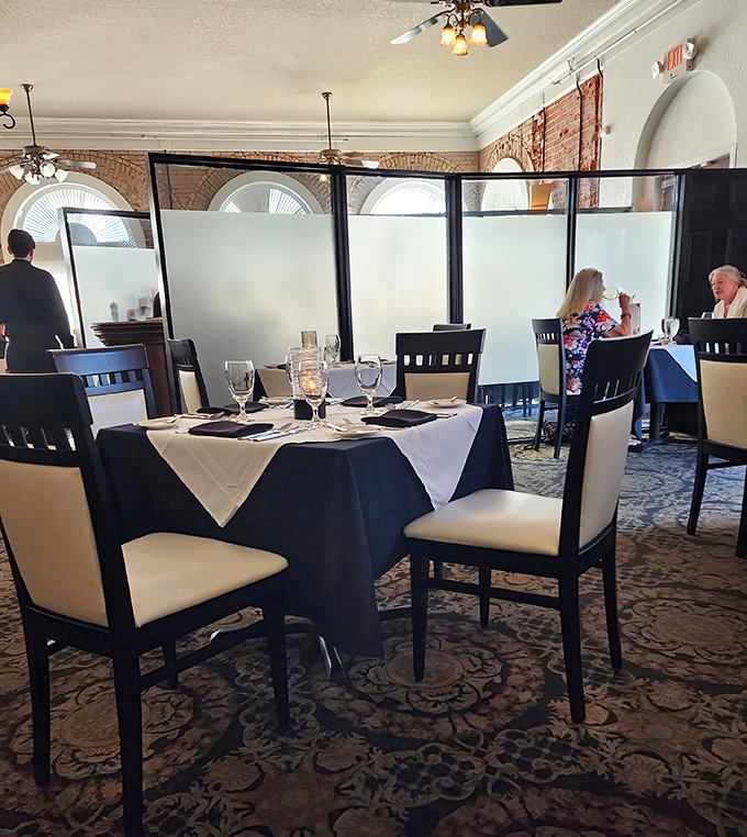 Privacy screens and intimate table settings&mdash;because sometimes the best dining experiences happen in your own little world, even in a full restaurant.