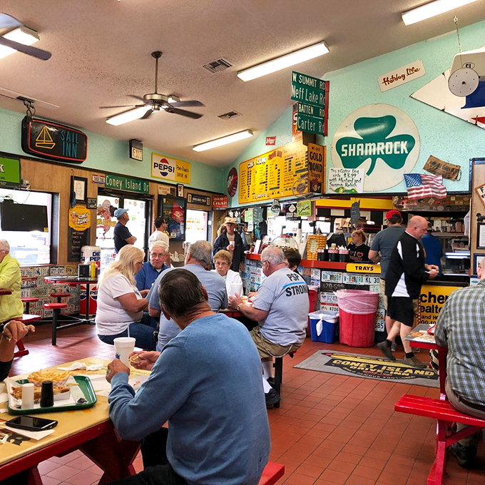 The lunch crowd knows the secret &ndash; this isn't just about the food; it's about the community that forms around these red tables and shared memories.