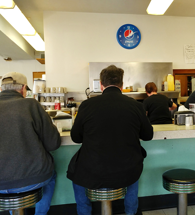 The counter&mdash;where regulars perch like birds on a wire, sharing news, weather reports, and occasional life wisdom.