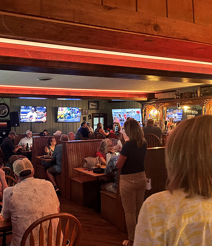The tavern's bar area buzzes with the energy of locals and travelers alike, all united in the pursuit of good food and better company.