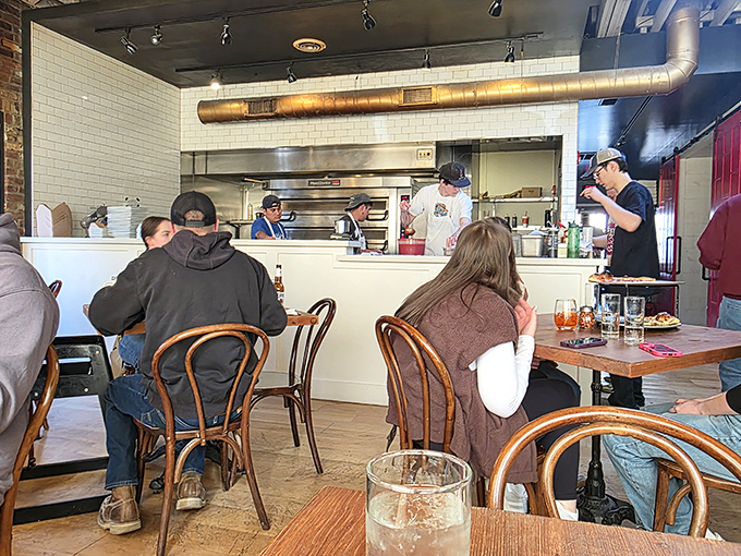 The open kitchen theater where dough becomes art and hungry diners become believers.