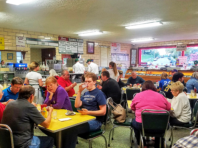 The dining room buzzes with conversation and the universal language of satisfied ice cream enthusiasts.