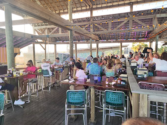 The outdoor dining area buzzes with the energy of happy diners. Everyone's on the same mission: maximum seafood consumption.v