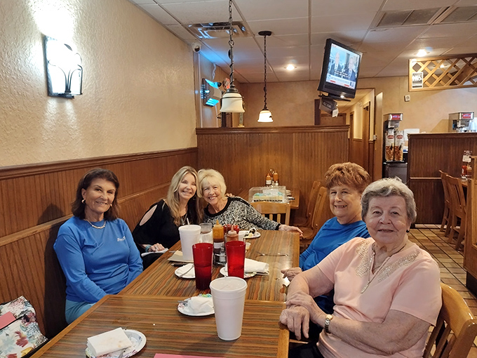 The true measure of a local spot: tables filled with regulars who've been coming so long they don't even need to look at the menu.