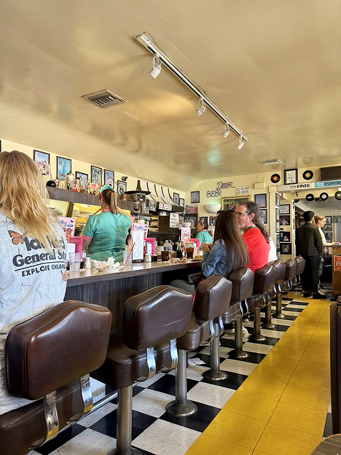 Where strangers become temporary family, united by vinyl seats and the universal language of "please pass the ketchup."