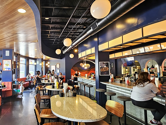 Fellow travelers on the breakfast odyssey, seated at wooden tables that feel both retro and futuristic&mdash;the perfect setting for morning philosophy.