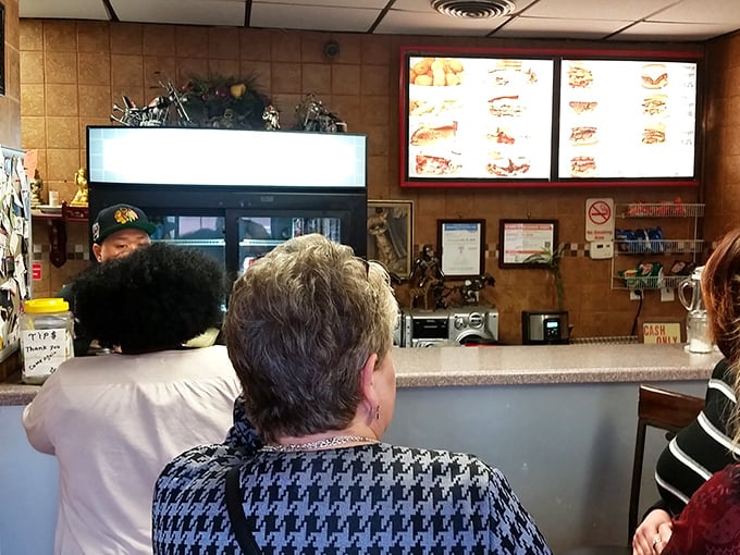 The lunch line at Kitty's: where CEOs stand behind construction workers, all equal in the democracy of good food. Some wait their whole lives for this moment.