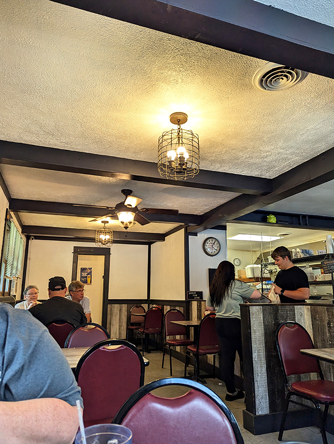 Where locals gather to break bread and share stories under cage-style lighting fixtures that have witnessed countless celebrations.